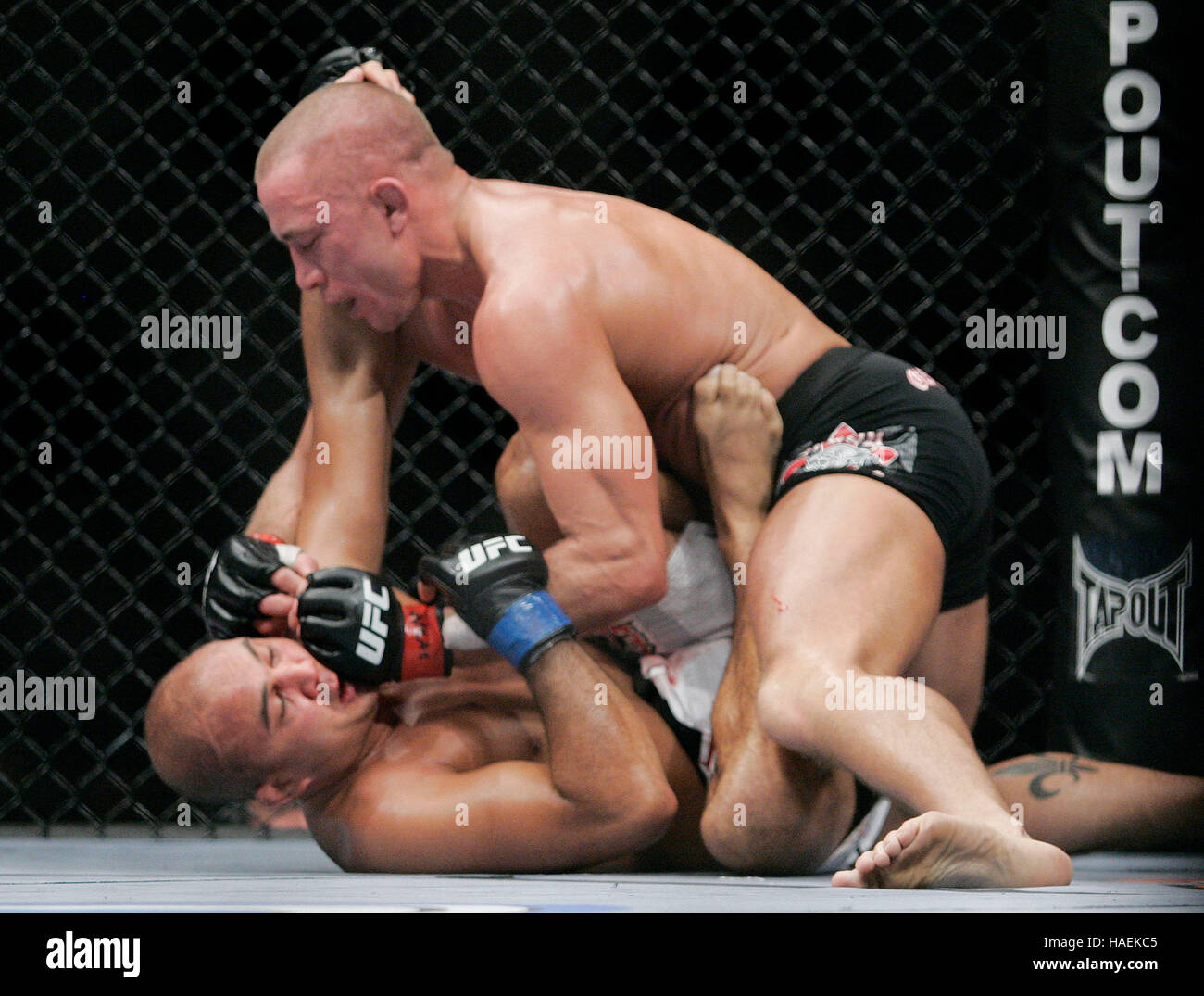 Georges St.-Pierre, top, fights BJ Penn at the UFC 94 at the MGM Grand ...