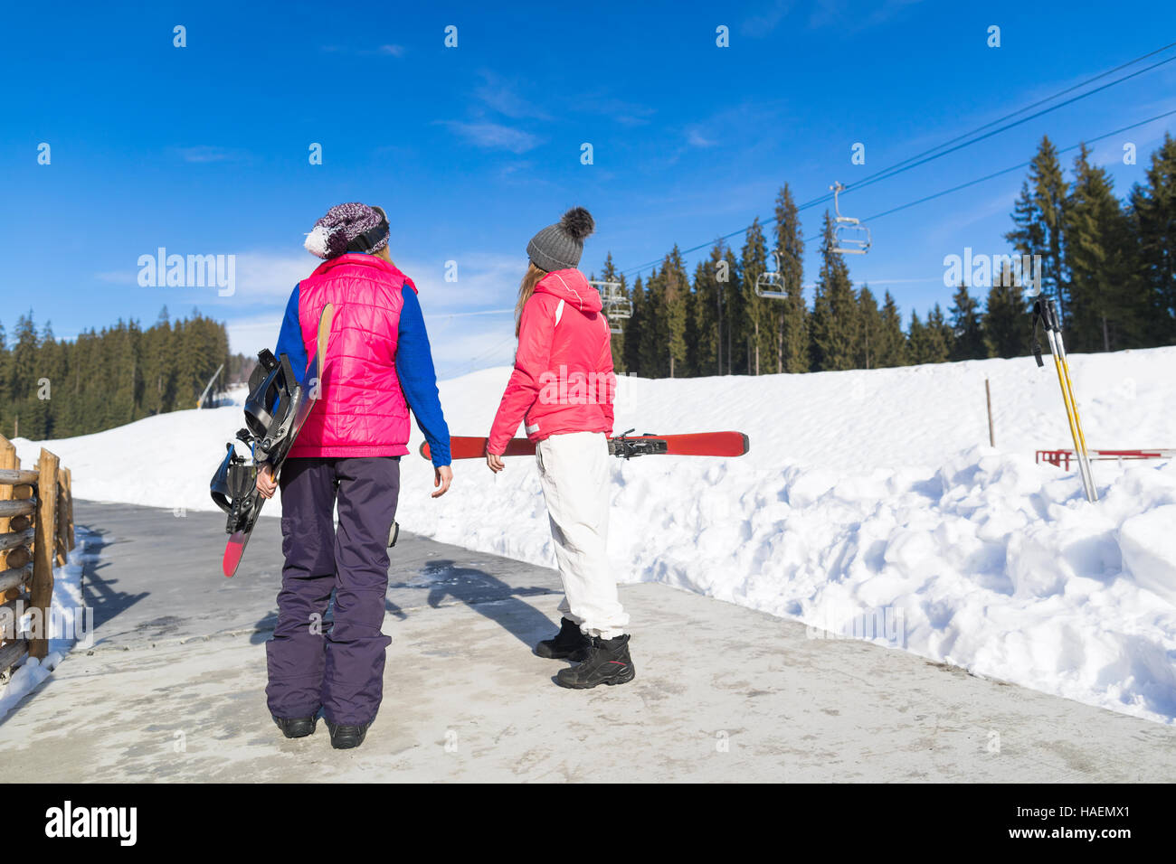 Two Woman Ski And Snowboard Resort Winter Snow Mountain Girls Holiday ...