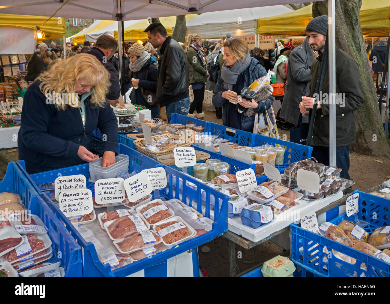 Customers at the fish and game stall at Stockbridge Sunday Market in ...