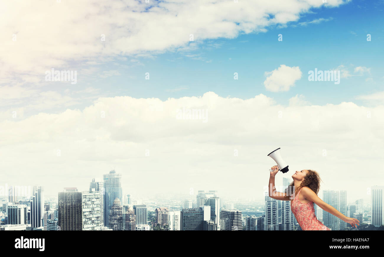 Girl screaming in loudspeaker Stock Photo - Alamy