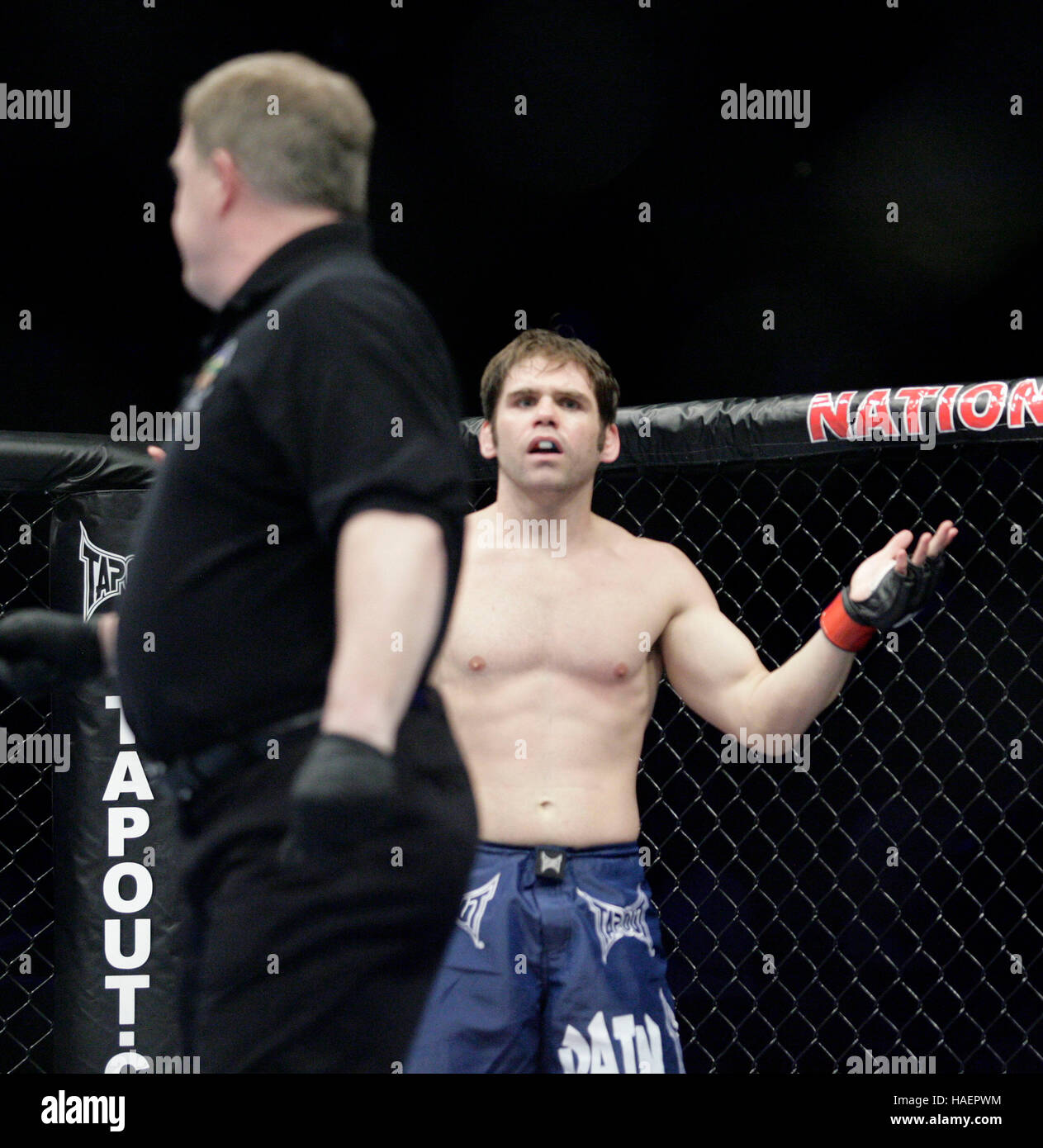 Aaron Riley throws his hands up after referee stopped fight against ...