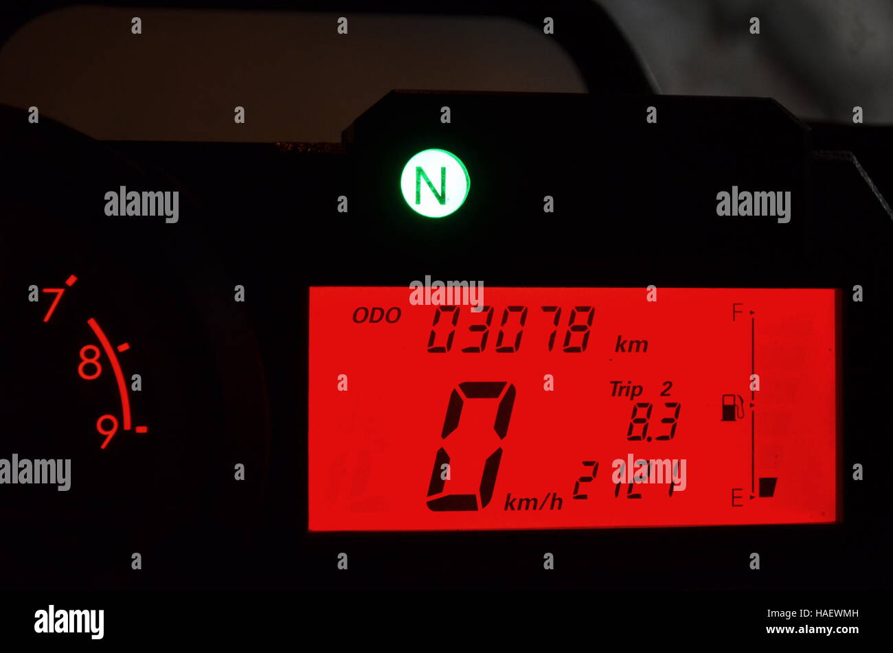 motorcycle dial with black numbers on a red background Stock Photo - Alamy