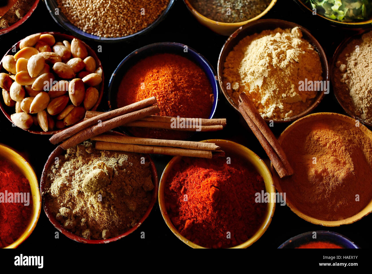 Indian spices make a colorful display in this photo. Items include ...