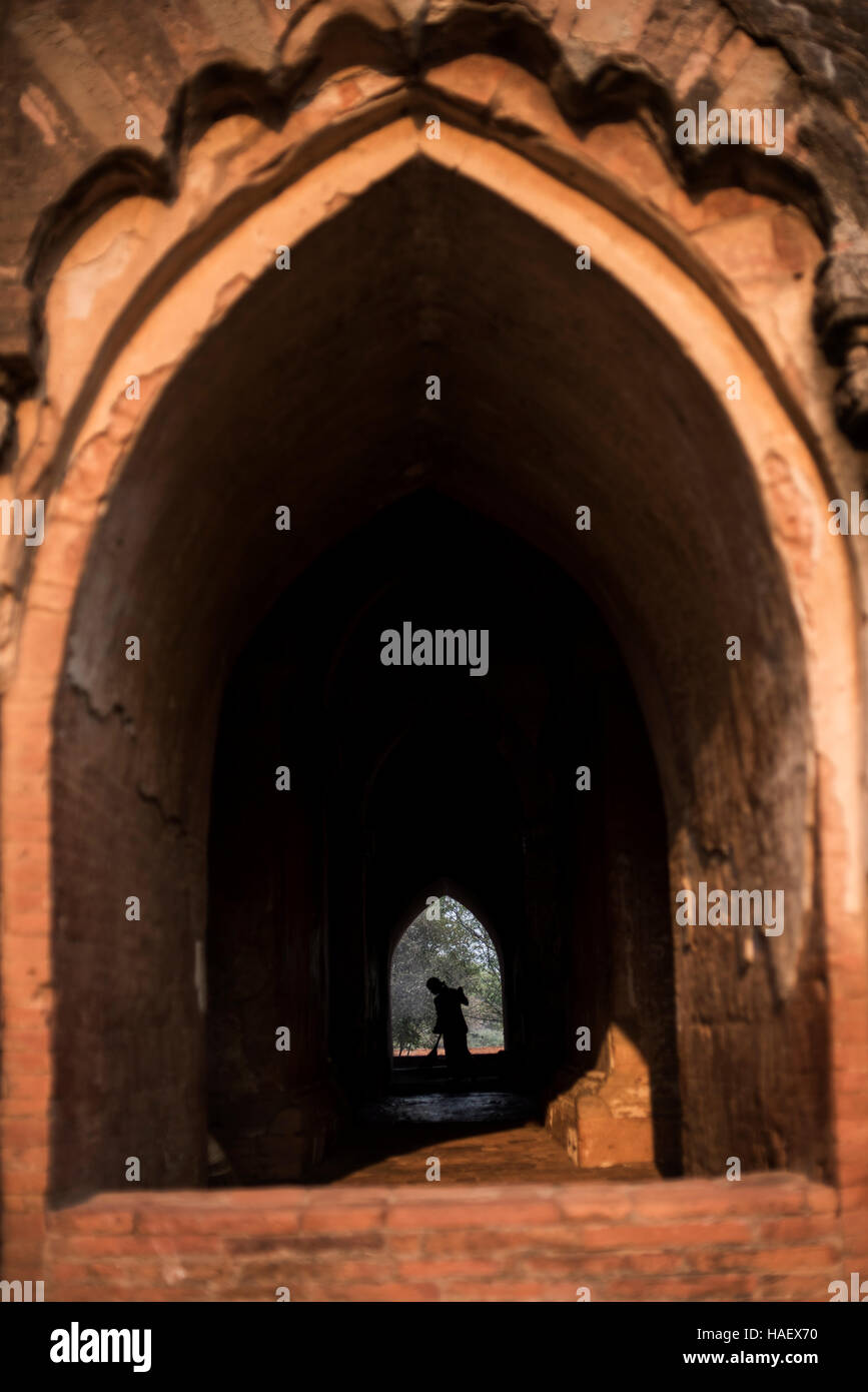 A woman sweeping inside the Dhammayangyi Temple, Bagan, Myanmar Stock ...