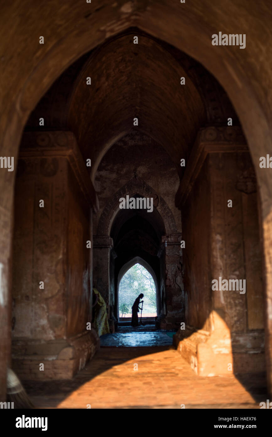 A woman sweeping inside the Dhammayangyi Temple, Bagan, Myanmar Stock ...