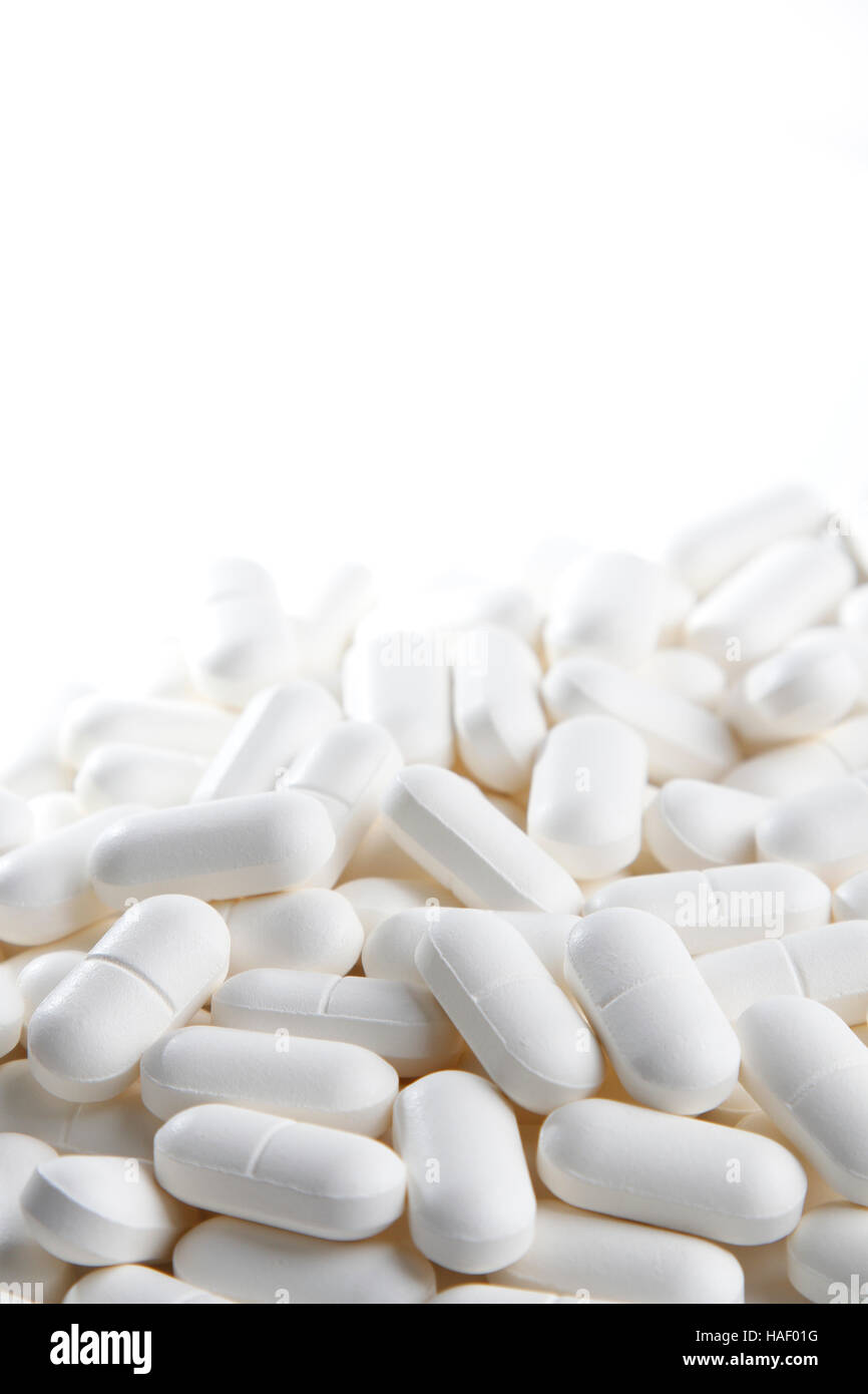 Pile of tablets closeup, copy space Stock Photo - Alamy