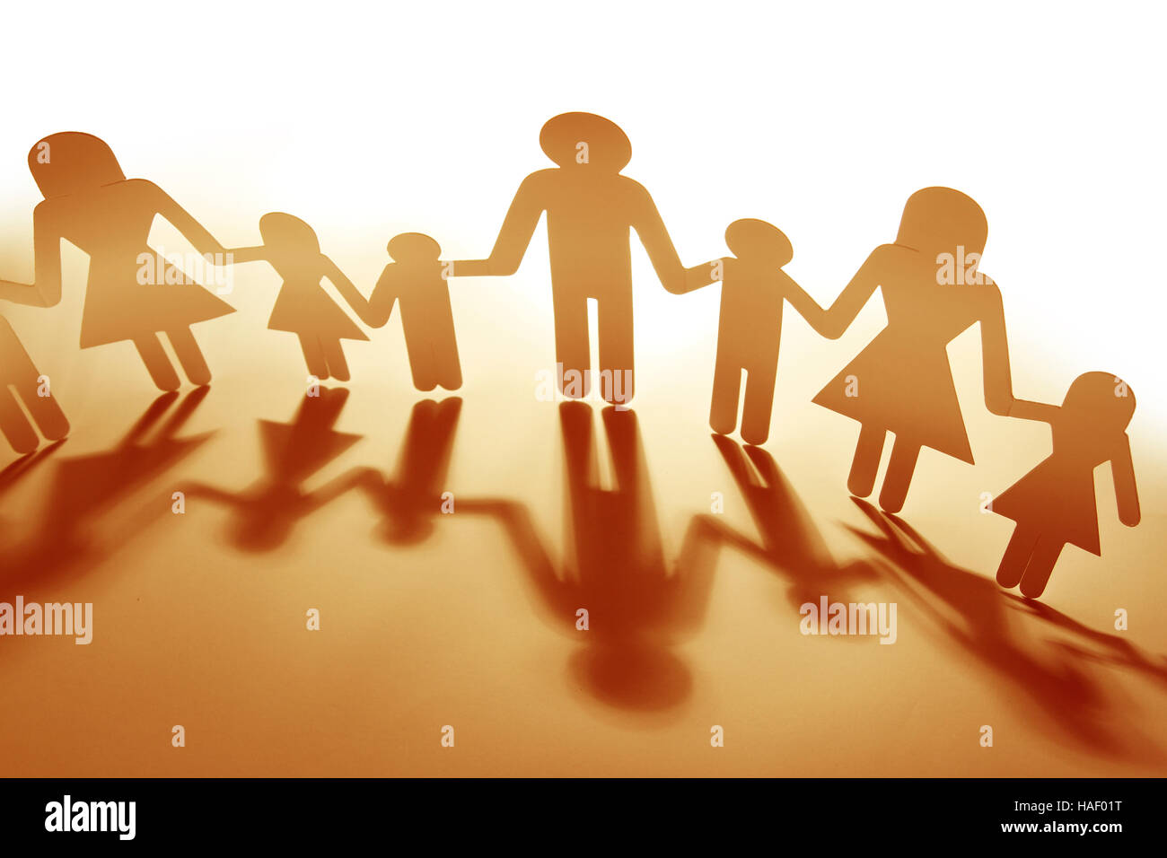 Family paper chain cutout holding hands Stock Photo - Alamy