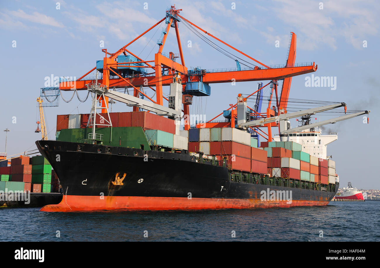 Container Ship is loading in a port Stock Photo - Alamy