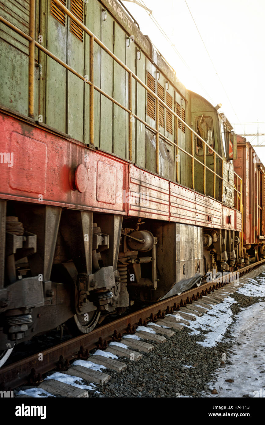 Vintage old diesel powered train moving along a traintrack with bright ...