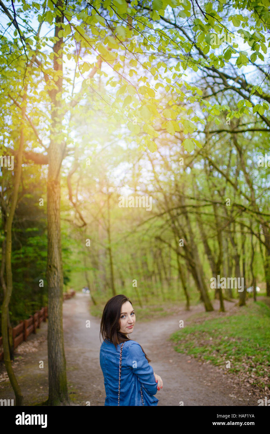 Young girl on a walk in the forest Stock Photo - Alamy