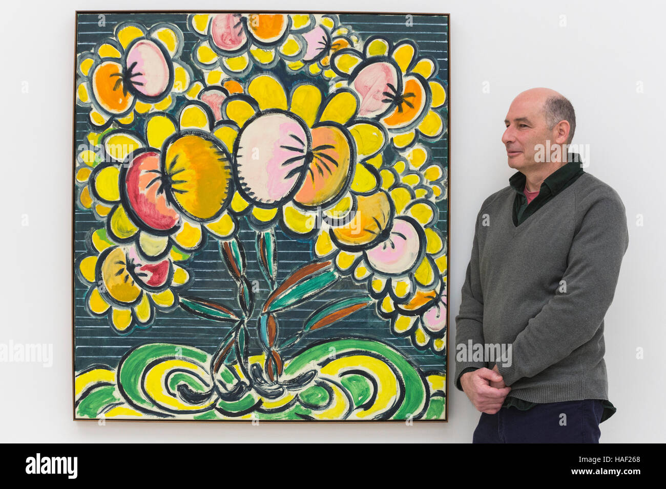 Artist Ansel Krut poses with his painting Arse Flowers in Bloom, 2010 ...