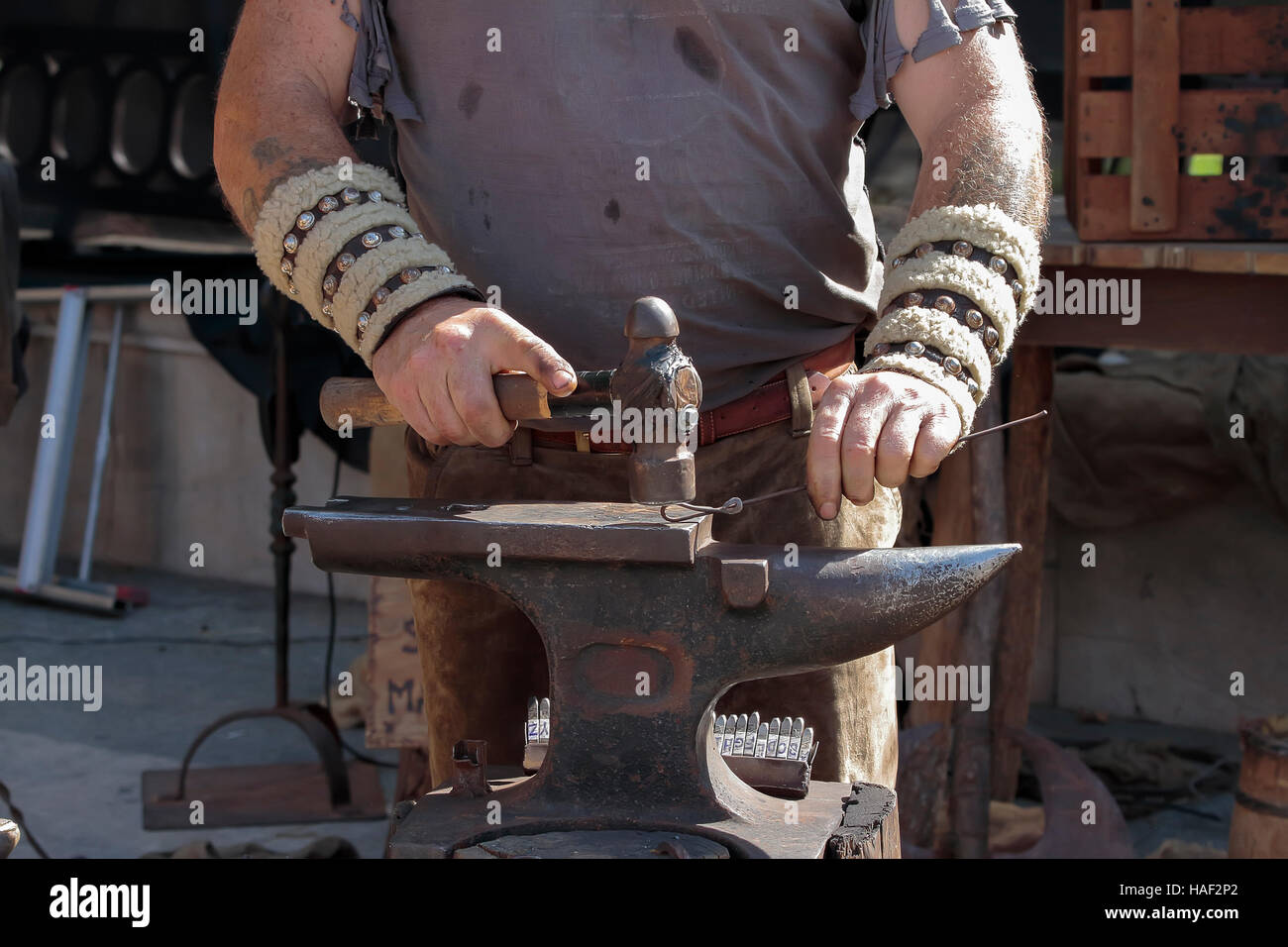 foreground of hands of a blacksmith working on the anvil Stock Photo ...