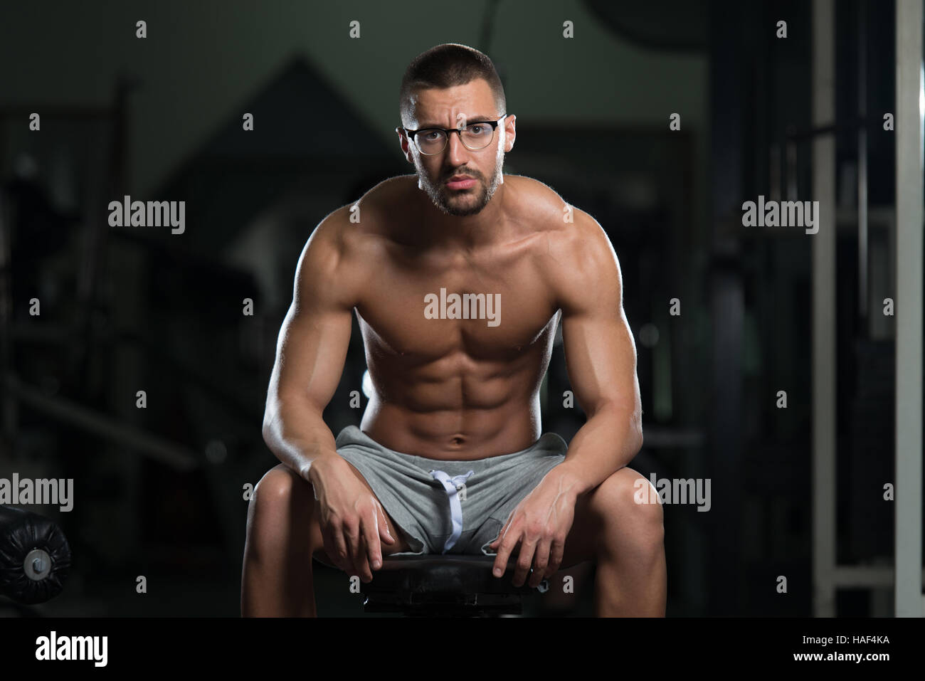 Strong muscular man in glasses hi-res stock photography and images - Alamy