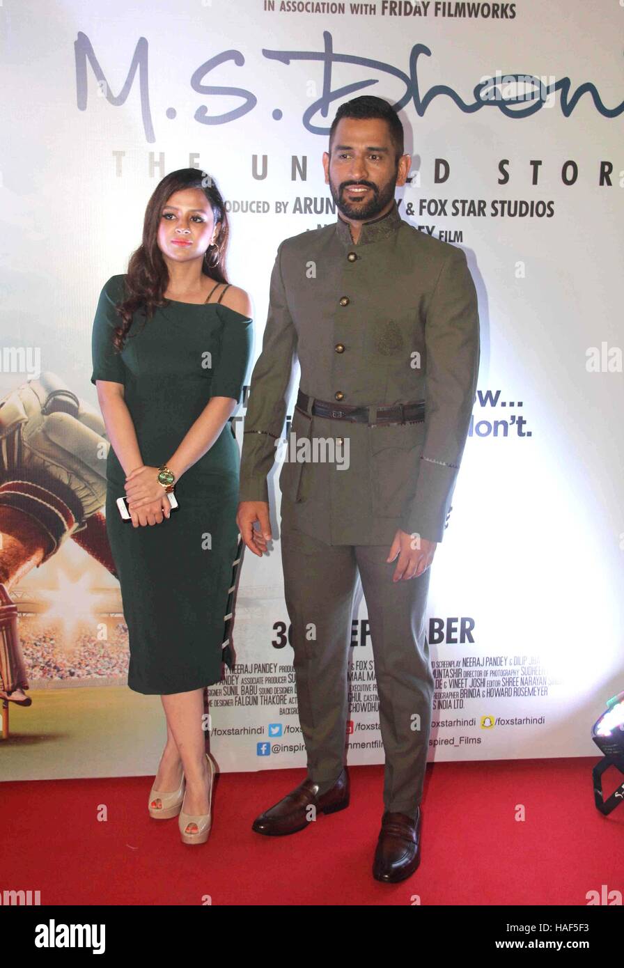 Indian cricket player Mahendra Singh Dhoni along with his wife Sakshi ...