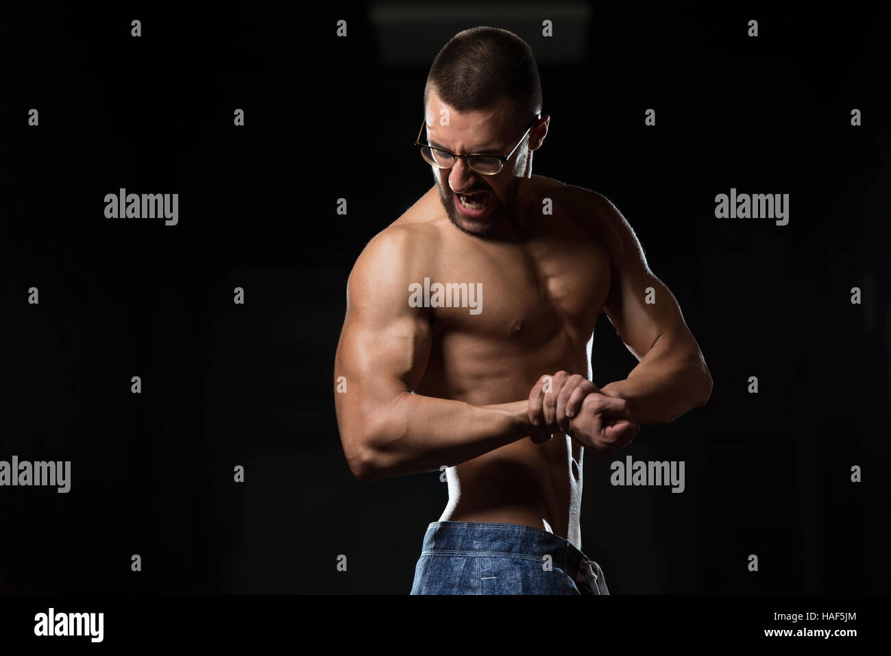 Geek flexing muscles hi-res stock photography and images - Alamy
