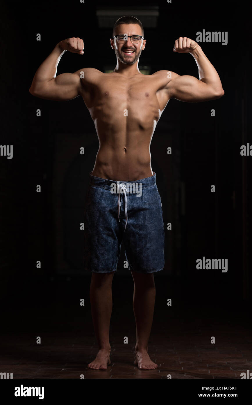 Geek flexing muscles hi-res stock photography and images - Alamy