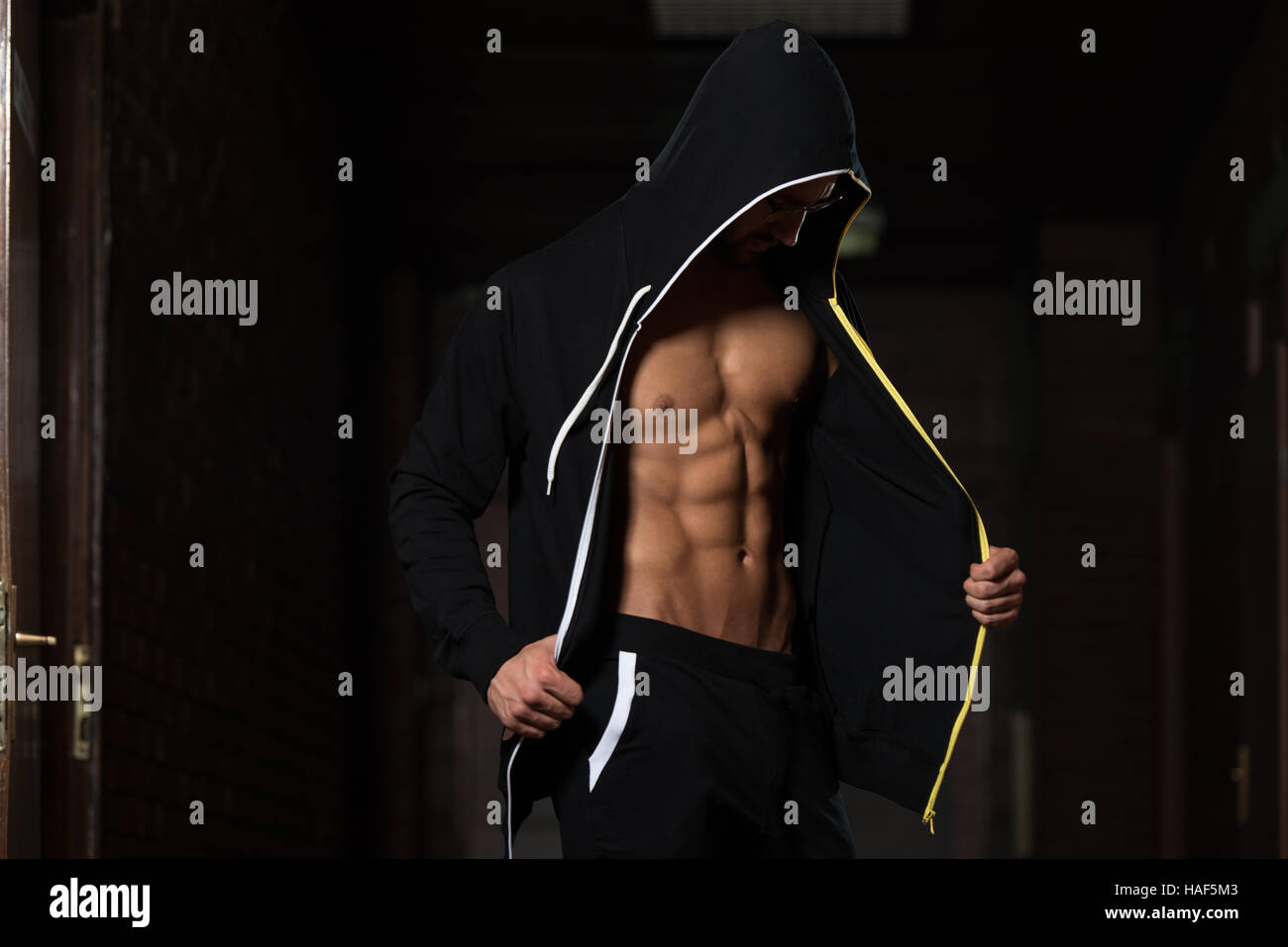 Portrait Of A Young Physically Fit Nerd Man Showing His Well Trained ...