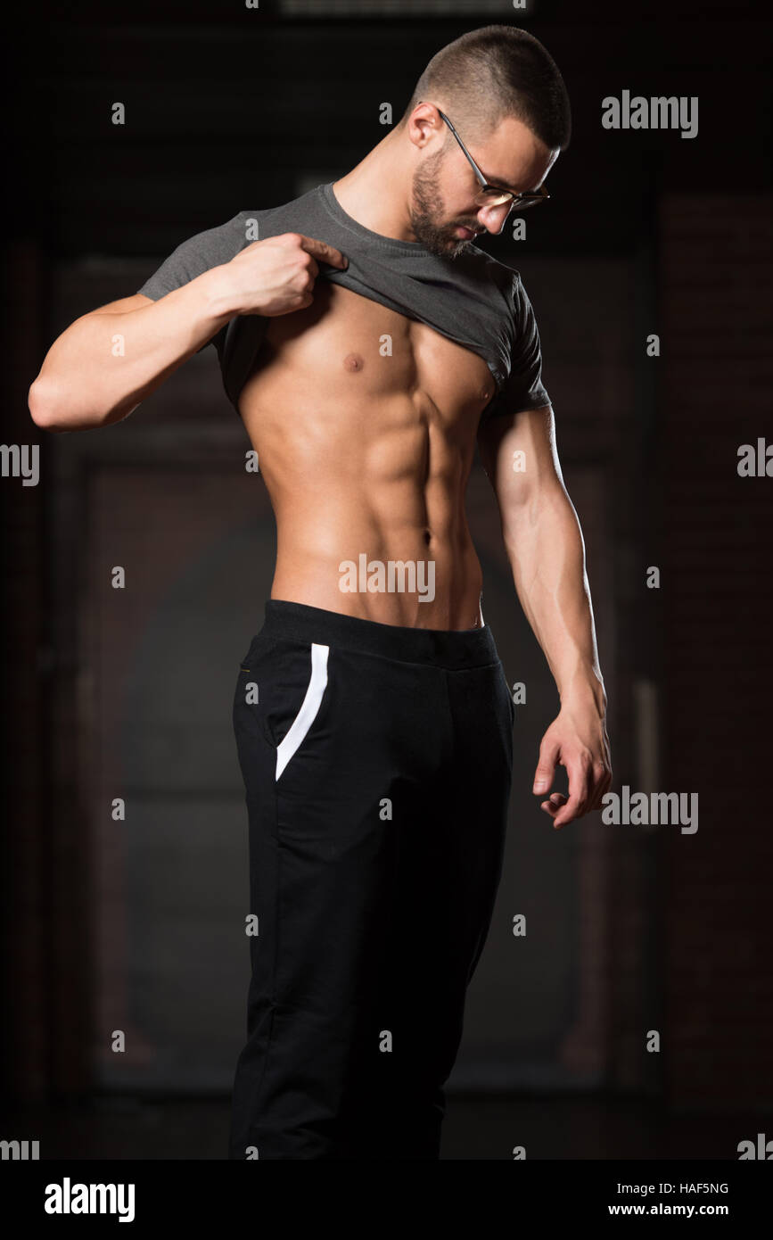 Geek flexing muscles hi-res stock photography and images - Alamy