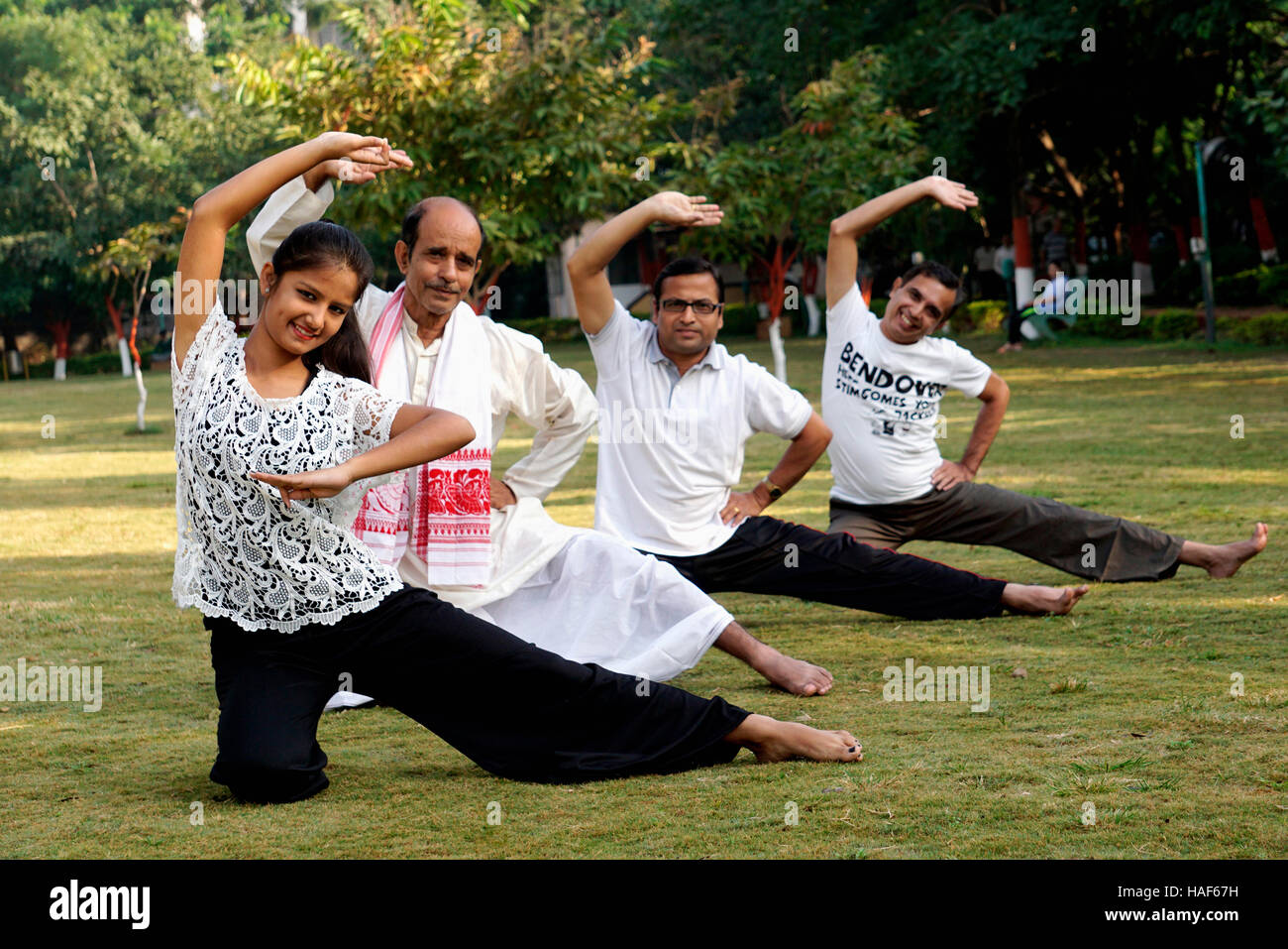 Group of people doing another variety of Jatoni, for flexibility of the ...