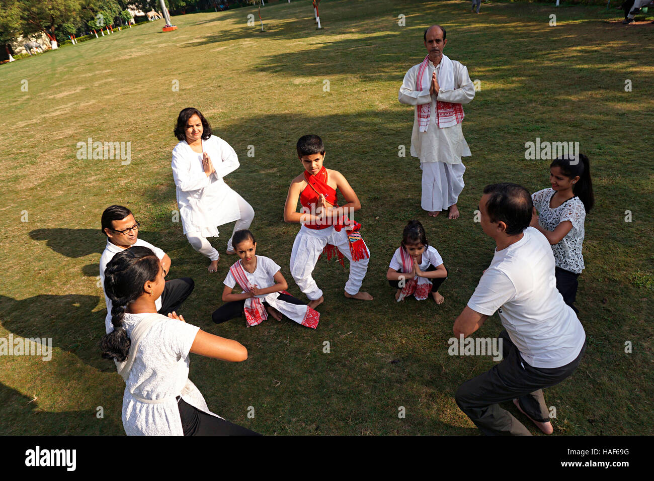 Group of people sitting up and down in Ora or knee out position which ...