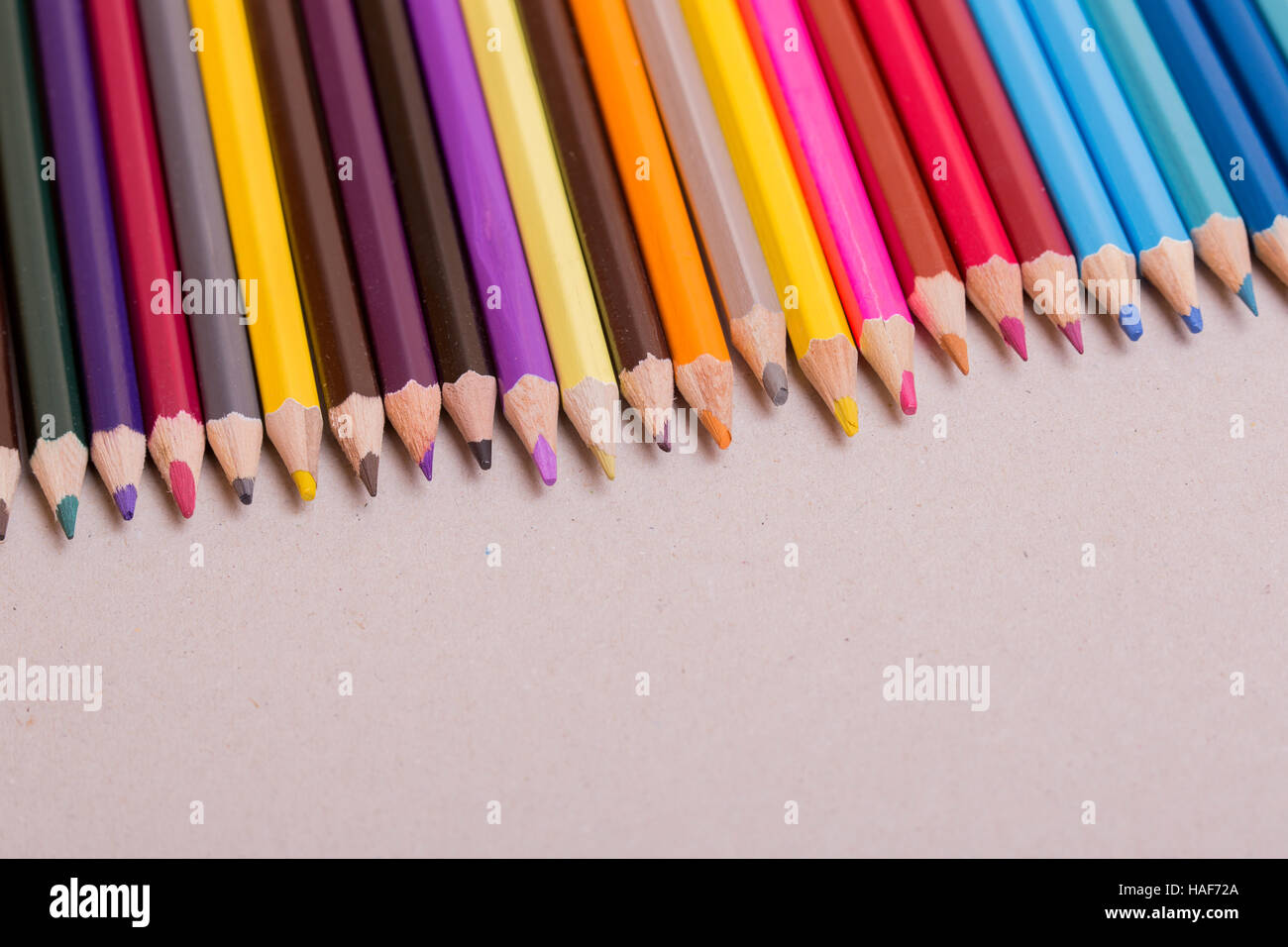 Wooden colorful pencils, on a grey paper Stock Photo - Alamy