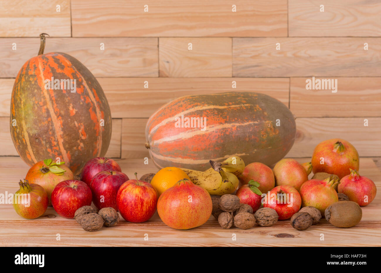 Autumn nature fruits concept. Fall fruits on a wooden table, studio ...