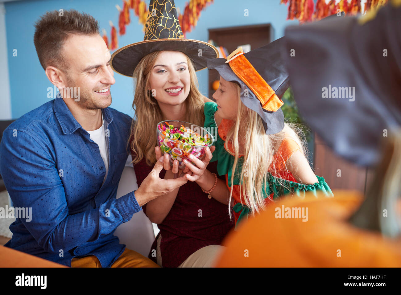 Parents giving the candies in Halloween Stock Photo - Alamy