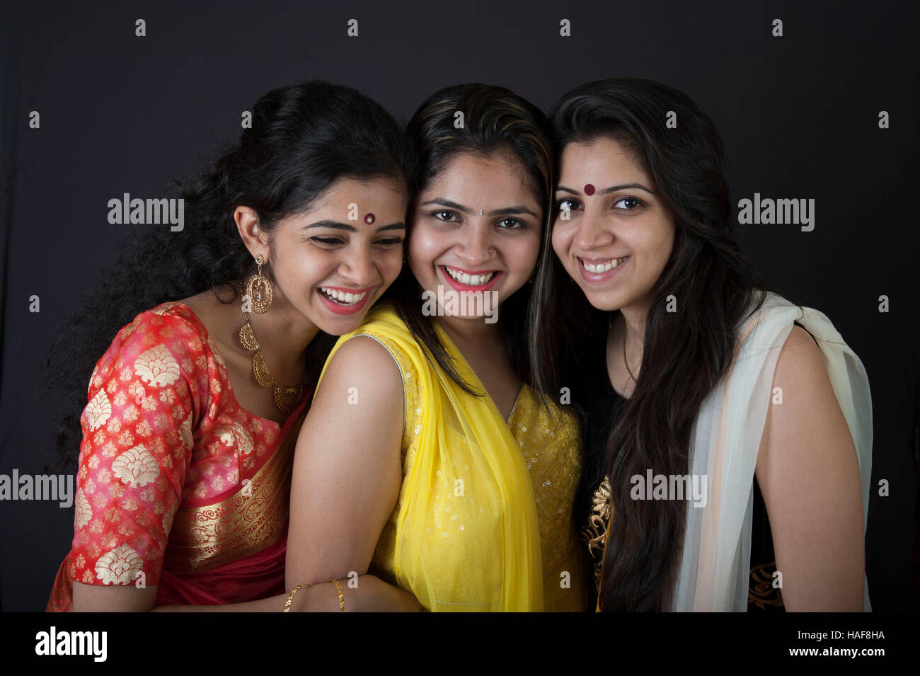 Three girls standing hi-res stock photography and images - Alamy