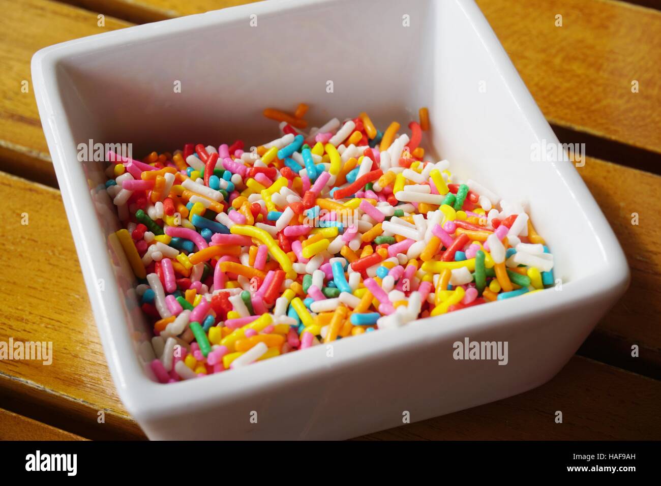 Bowl of colorful edible confetti sprinkles Stock Photo - Alamy