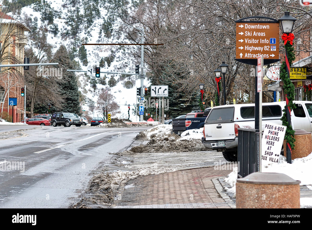 Empty road in Glenwood Springs, Colorado, with cars parked in front of ...