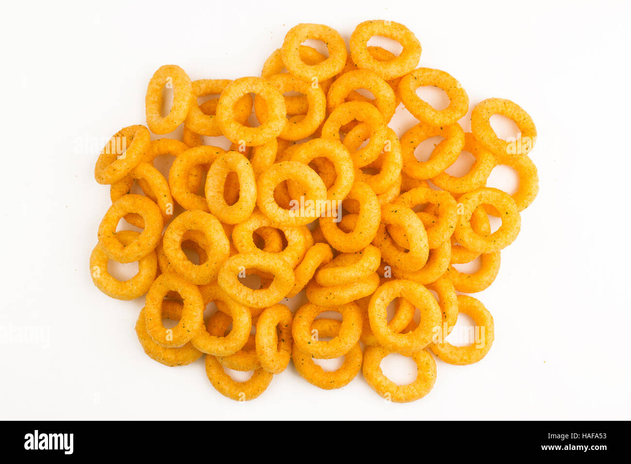 top view of many yellow round corn puff snacks isolated on white ...