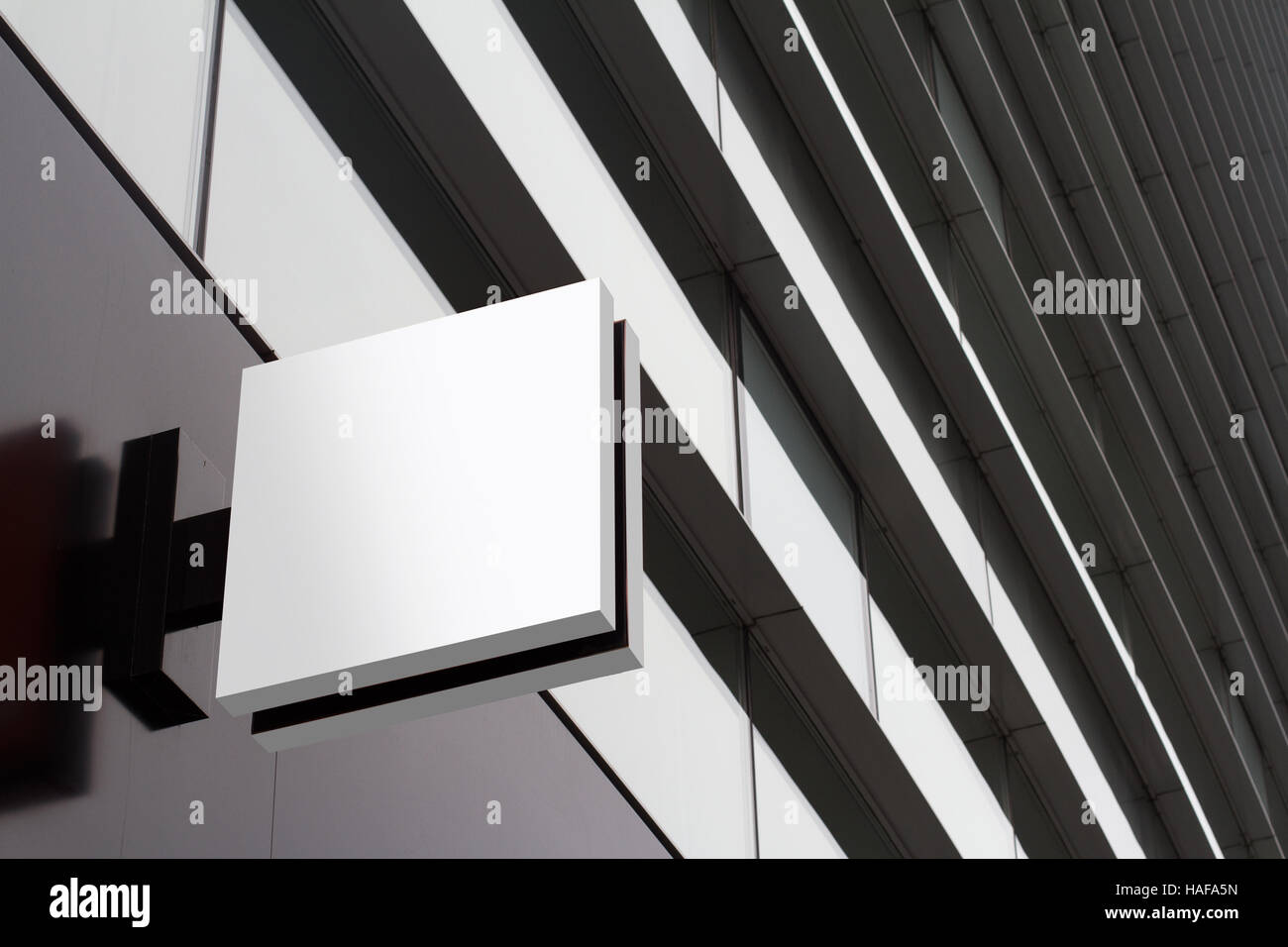 Horizontal side view of empty white signage on business skyscraper with ...