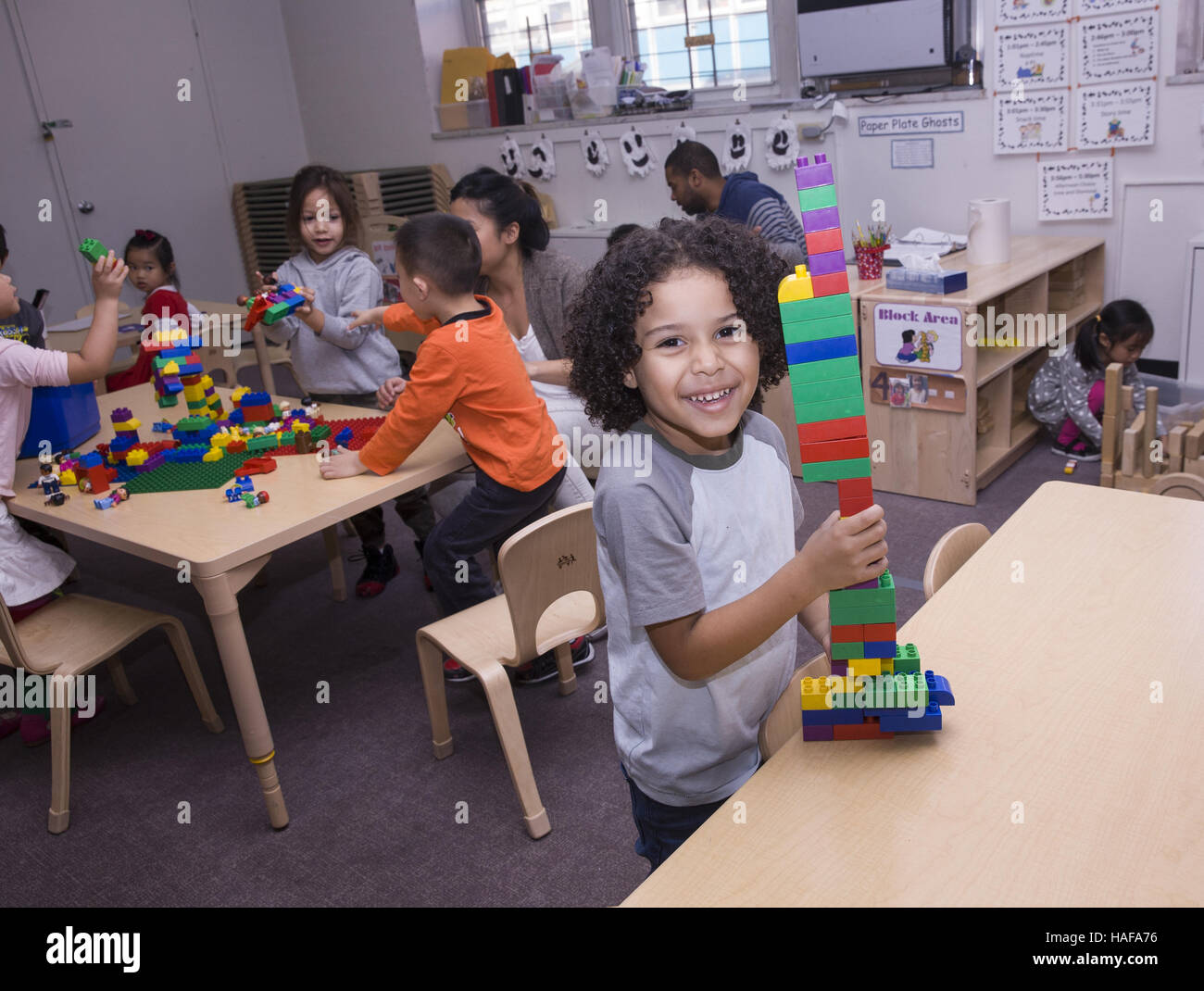 Young children build with Lego blocks at a nursery school in Manhattan ...