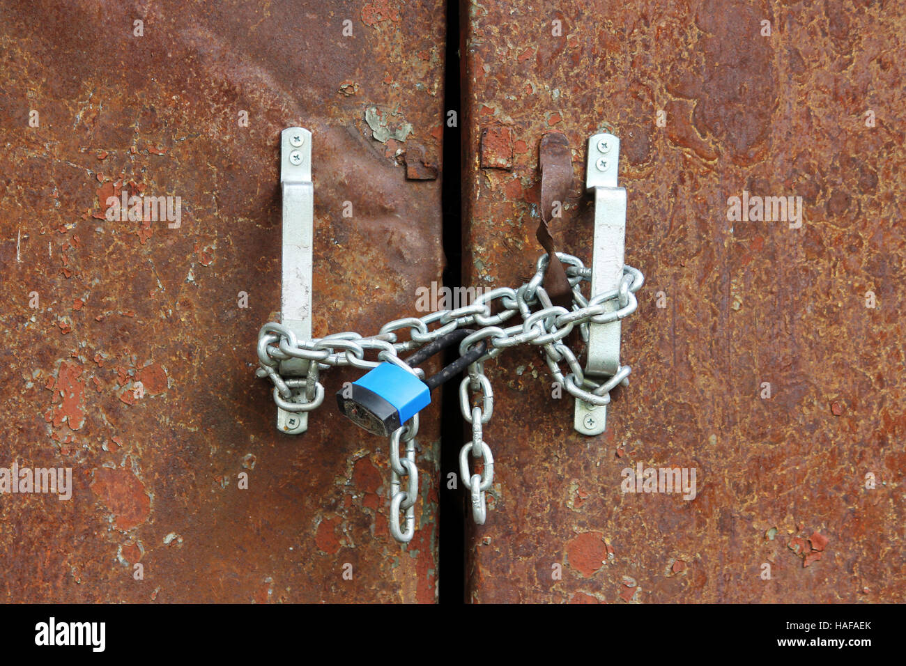 blue lock on the chain rusty door locks transformer station Stock Photo ...