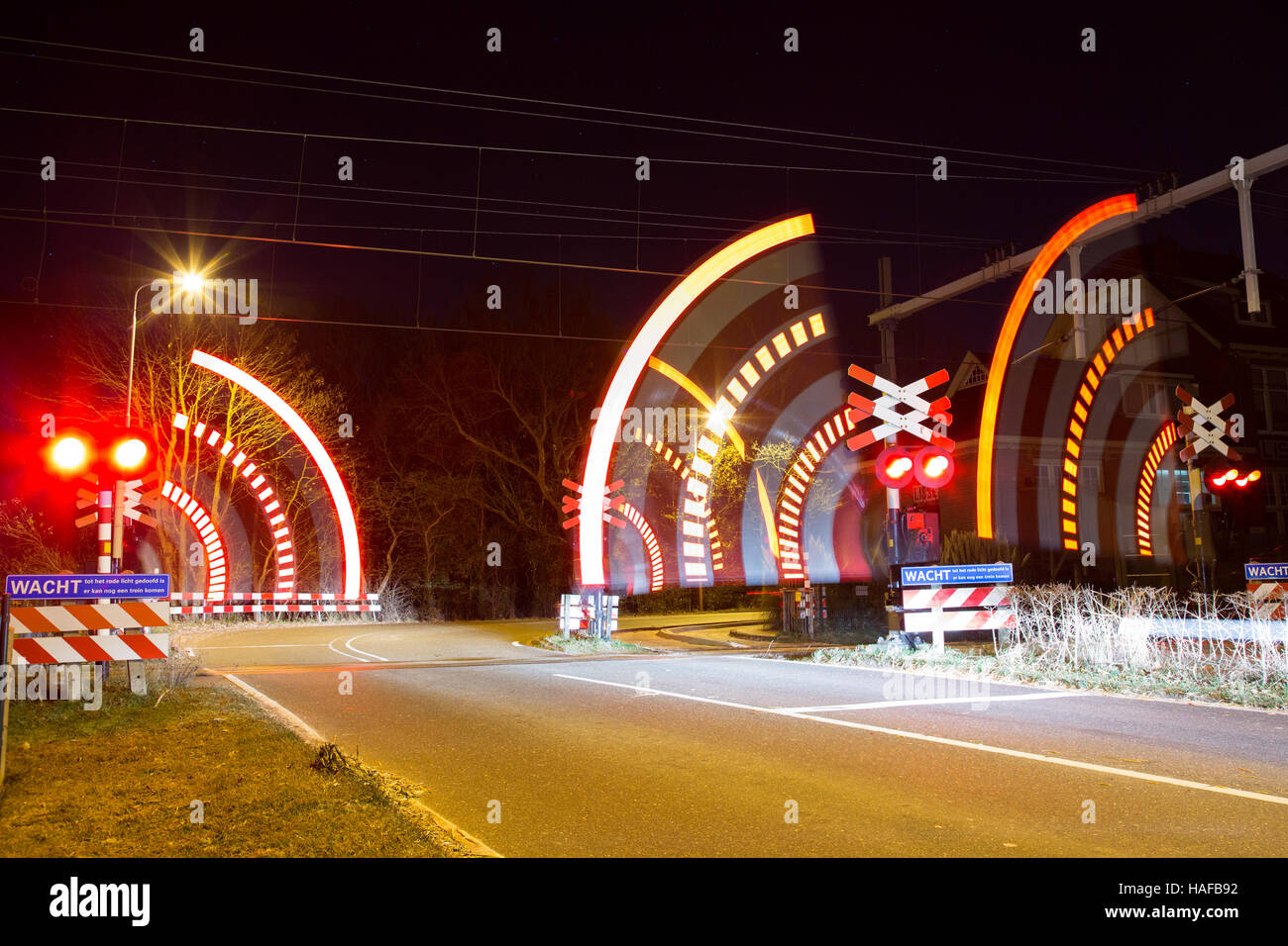 Train crossing an railway crossing at night hi-res stock photography ...