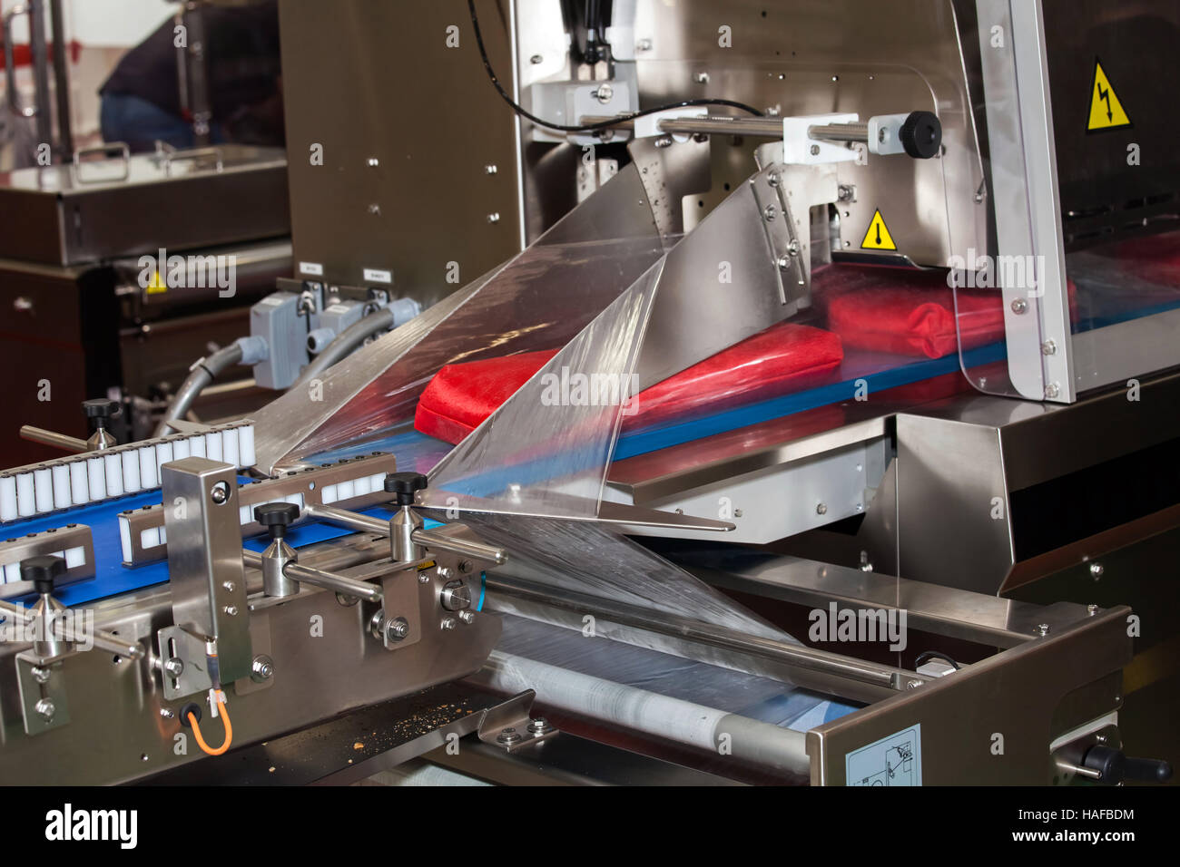 Packaging line machine Stock Photo - Alamy