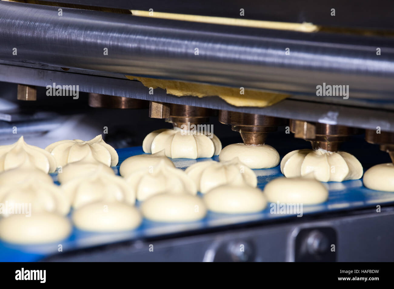 Biscuit depositing machine Stock Photo - Alamy