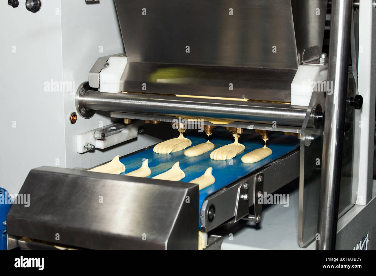 Biscuit depositing machine Stock Photo - Alamy