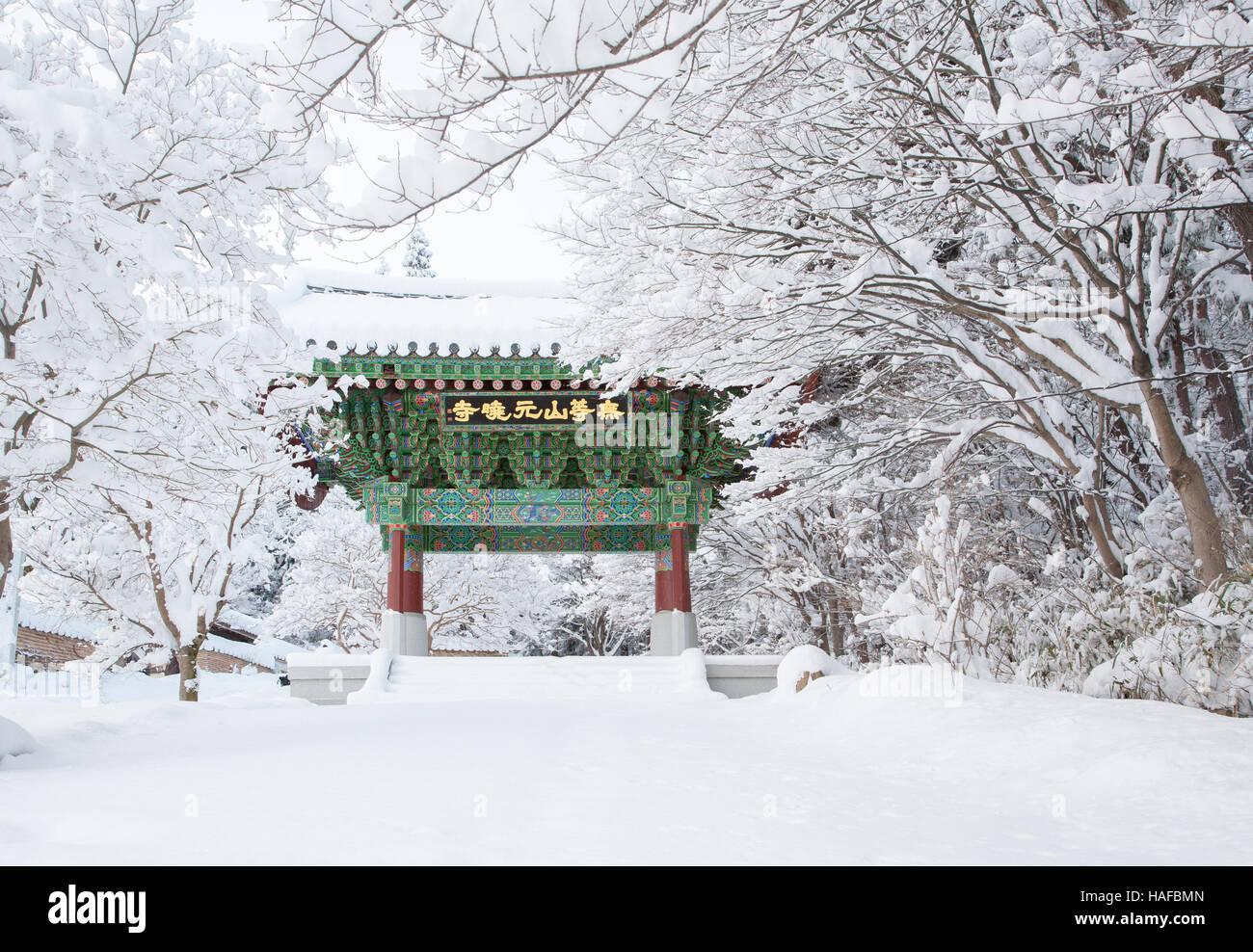 gate of Buddhist temple covered with snow in South Korea Stock Photo ...