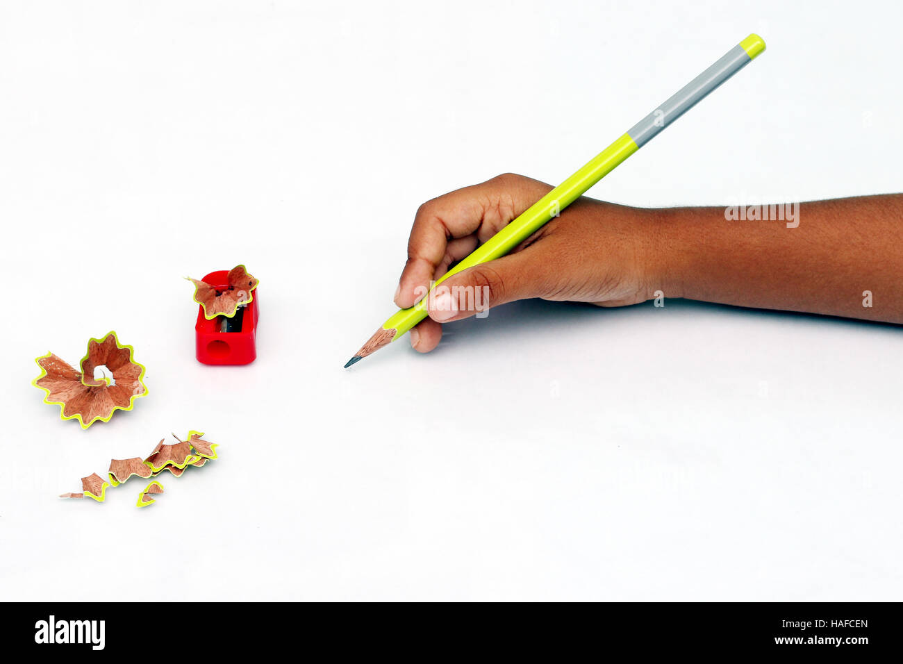 Child,s hand holding a colorful pencil, isolated on white Stock Photo ...