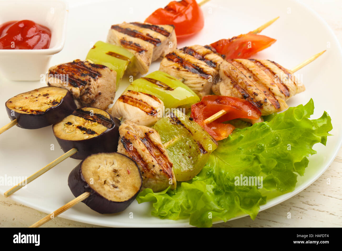 Chicken and vegetables skewer with tomato, pepper and eggplant Stock ...