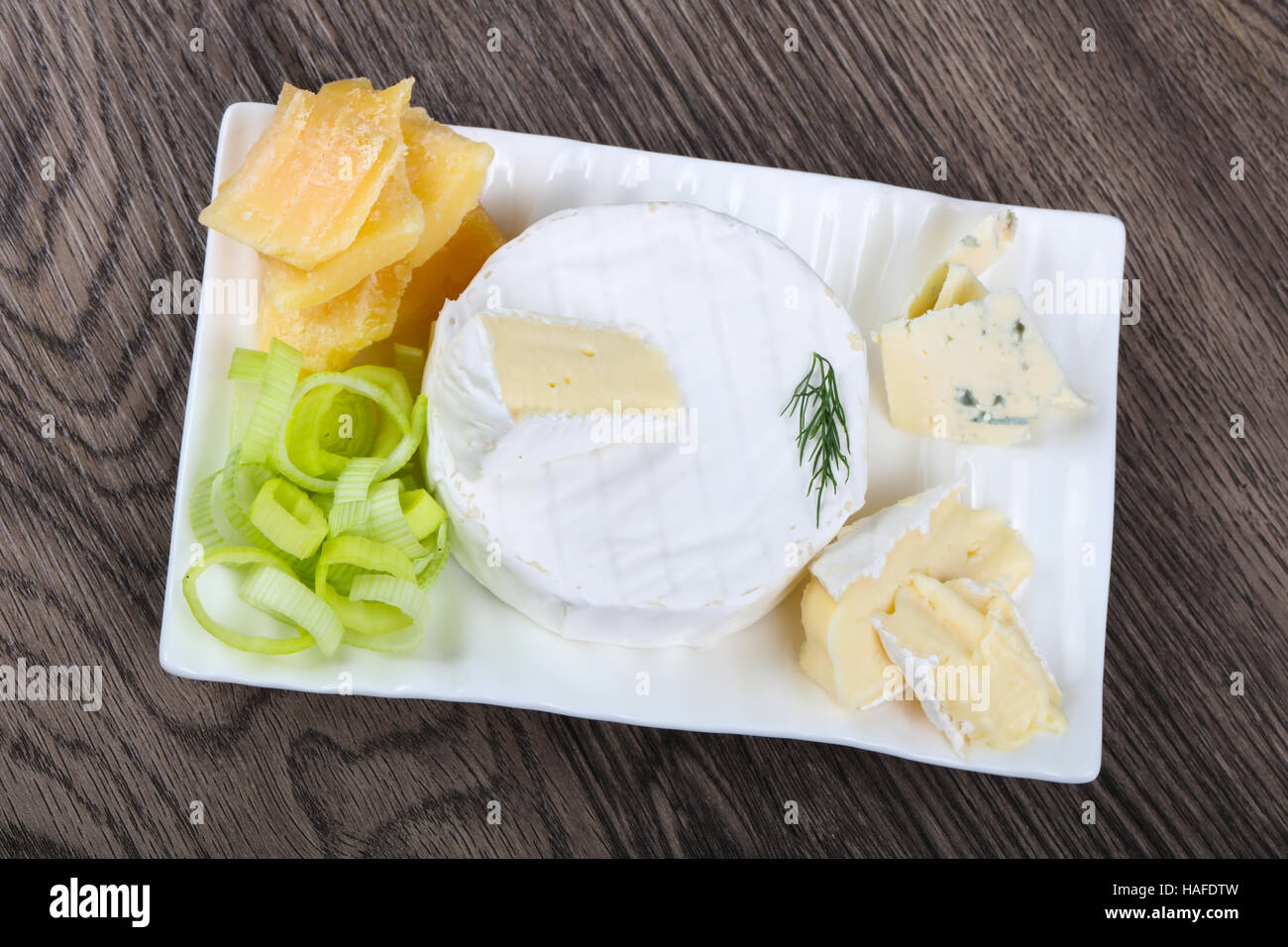 Cheese platter with brie, blue and parmesan Stock Photo - Alamy
