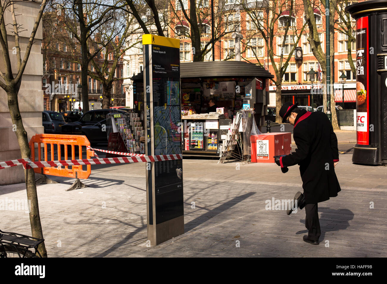 man stands on one leg to investigate mess on foot Stock Photo - Alamy