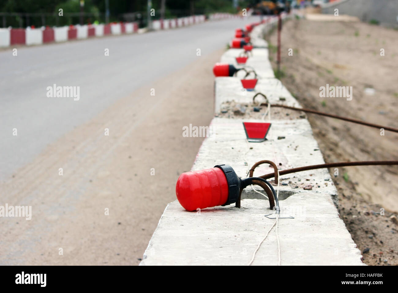 Signal lights on the fundamental blocks of concrete, fencing ...