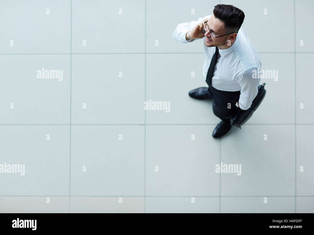 Mobile agent or entrepreneur speaking on cellphone Stock Photo - Alamy