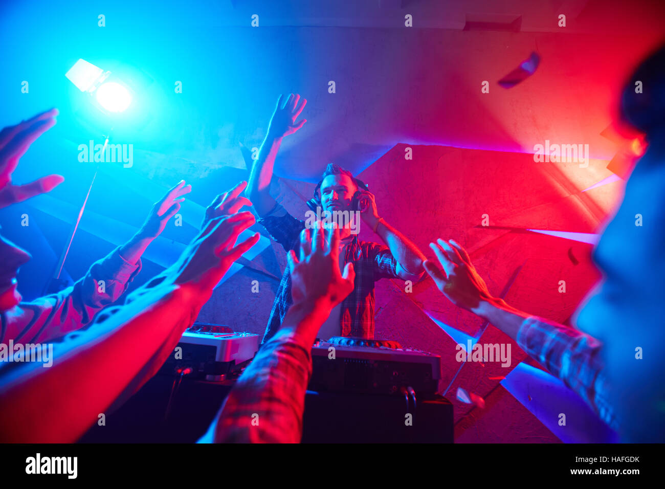 Ecstatic dj and young dancers enjoying night party Stock Photo - Alamy