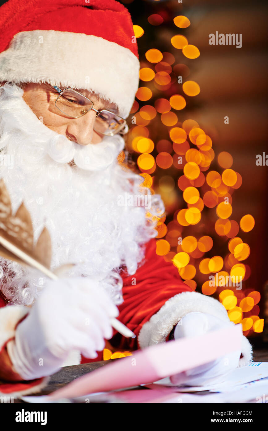 Santa Claus writing Christmas letter Stock Photo - Alamy