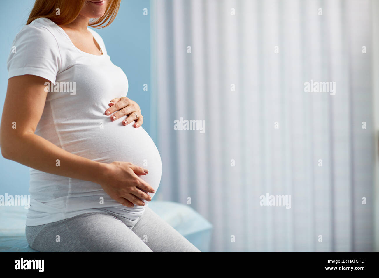 Pregnant woman sitting in childbearing center Stock Photo - Alamy
