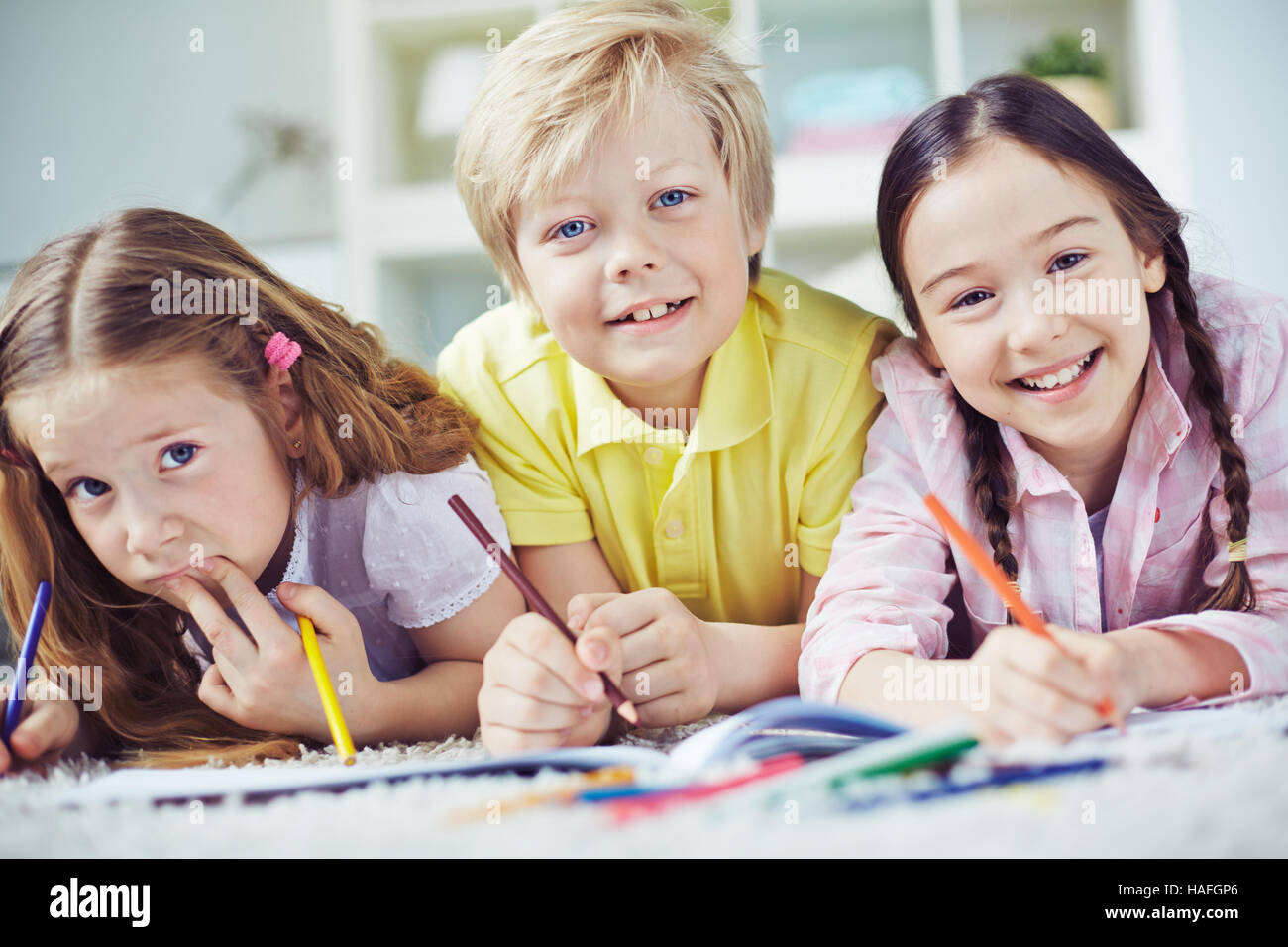 Little friends drawing with crayons in kindergarten Stock Photo - Alamy