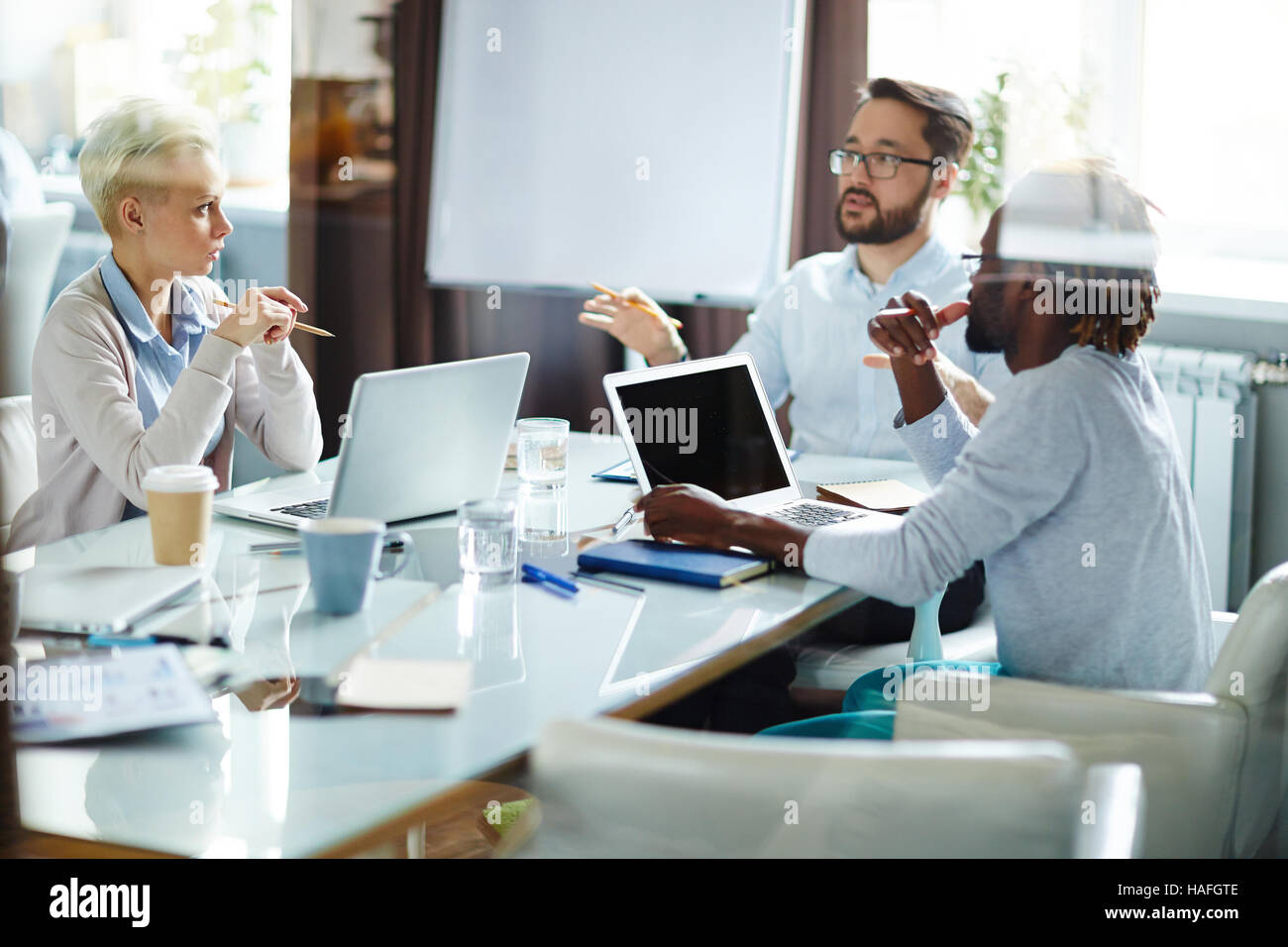 Business team brainstorming during discussion of plans Stock Photo - Alamy